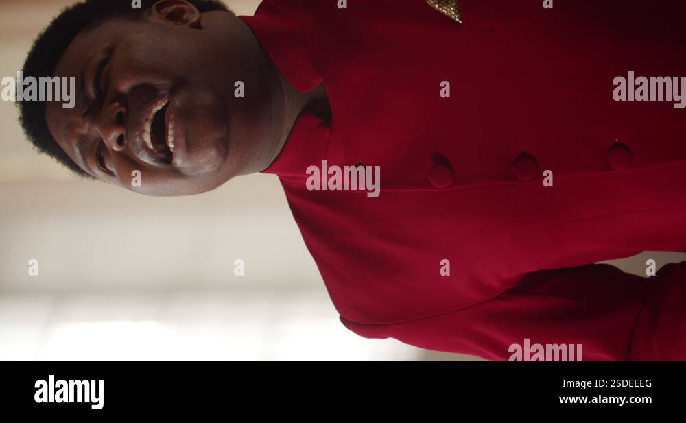 Close up view of talanted african american gospel singer in red suit ...
