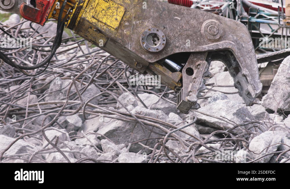 Hydraulic Crusher excavator machinery destroying cables and pipes of a ...