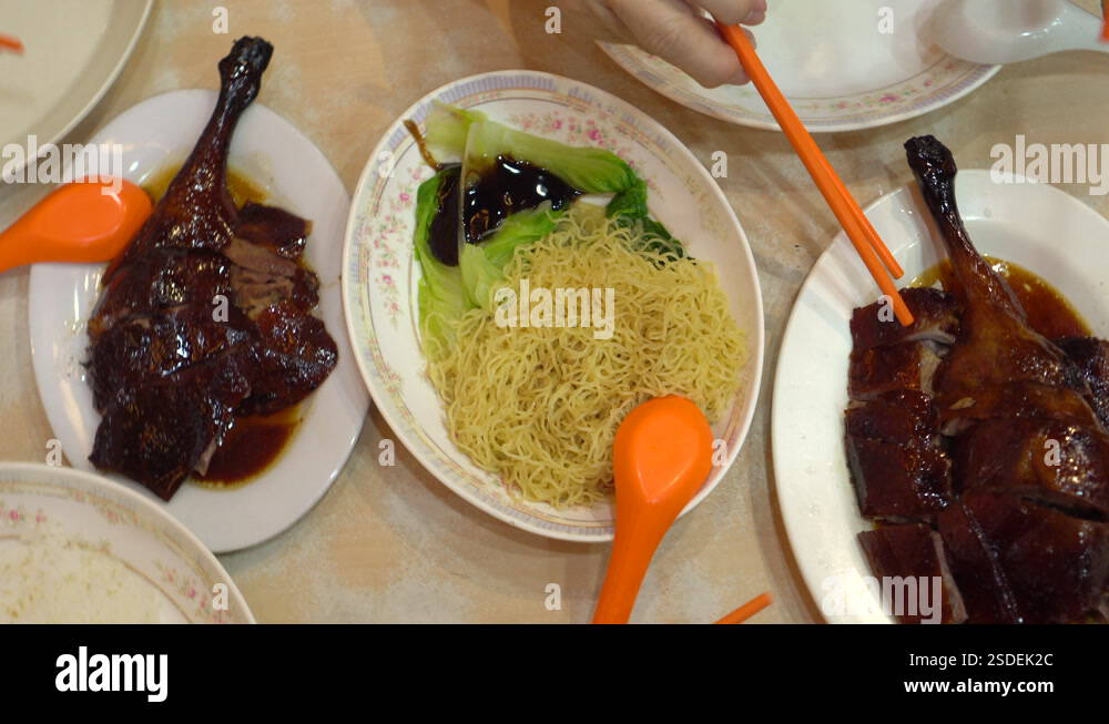Roasted geese with noodle top view eating Hong Kong food together Stock ...