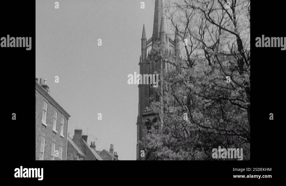 Peloton of cyclists rides through town, car splashes water at cyclist ...