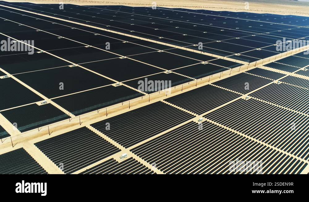 Aerial of solar panels field in California, mirrors in the middle of ...
