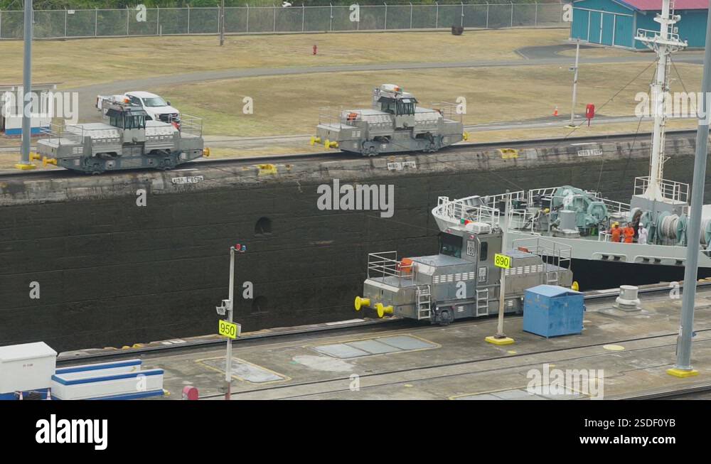Ship Being Towed Through The Panama Canal By Towing Mules Stock Video ...