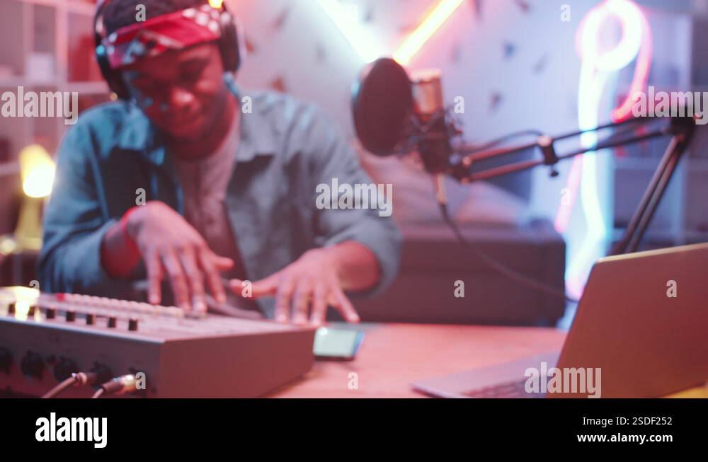 Young Afro-American Musician Using Mixing Console while Recording Track ...