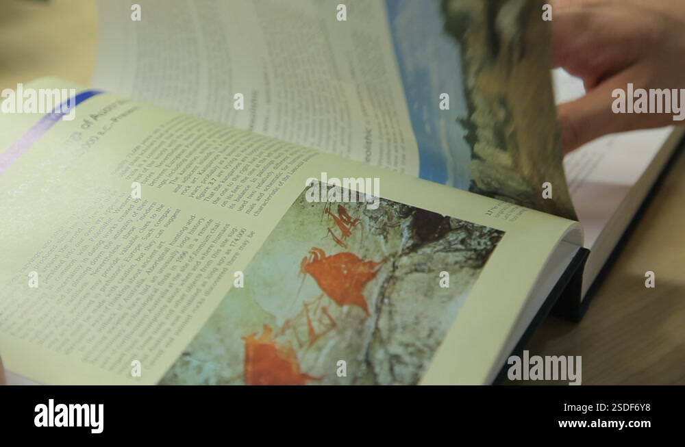 Turning pages of history book with images of popular tourist ...