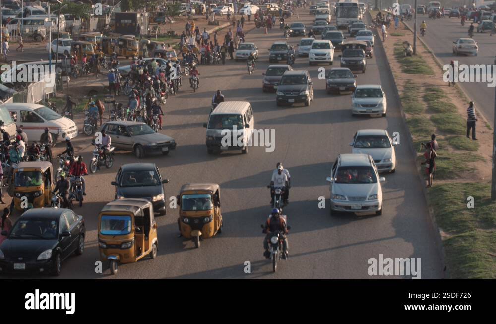 Busy area with people,Motor garage,cars, trucks and Motorcycle in a ...