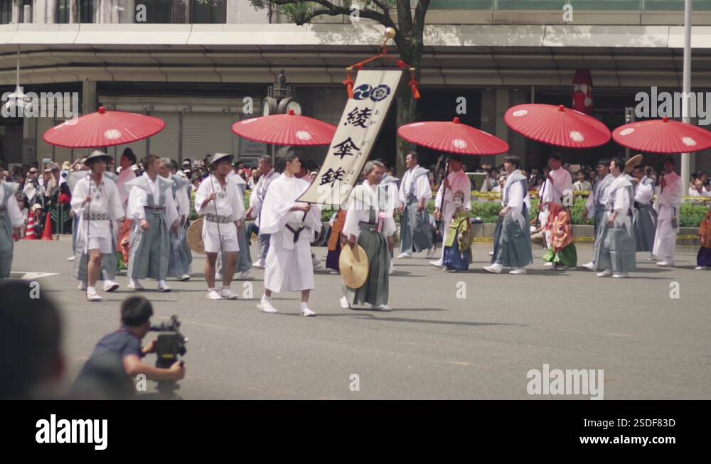 People In Traditional Japanese Costumes And Wagasa Marching On The ...