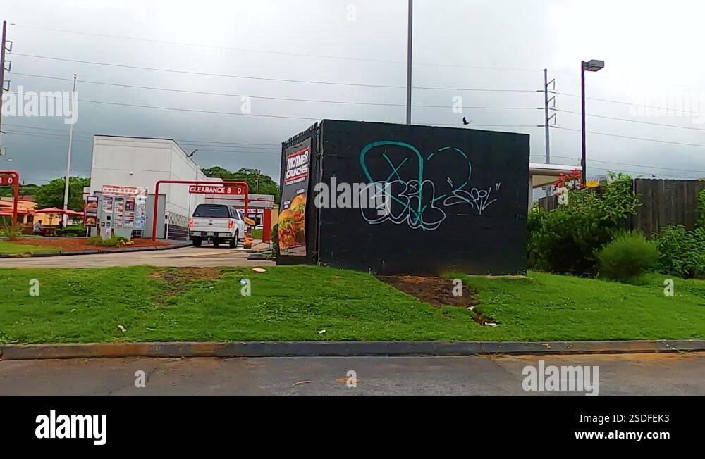 Back view of Krystal Burgers fast food drive thru and cars Stock Video ...