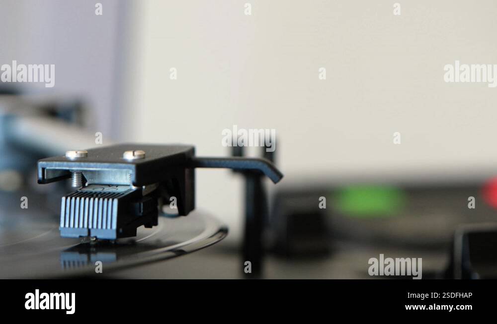 Vinyl record player spinning on vintage vinyl turntable player and ...