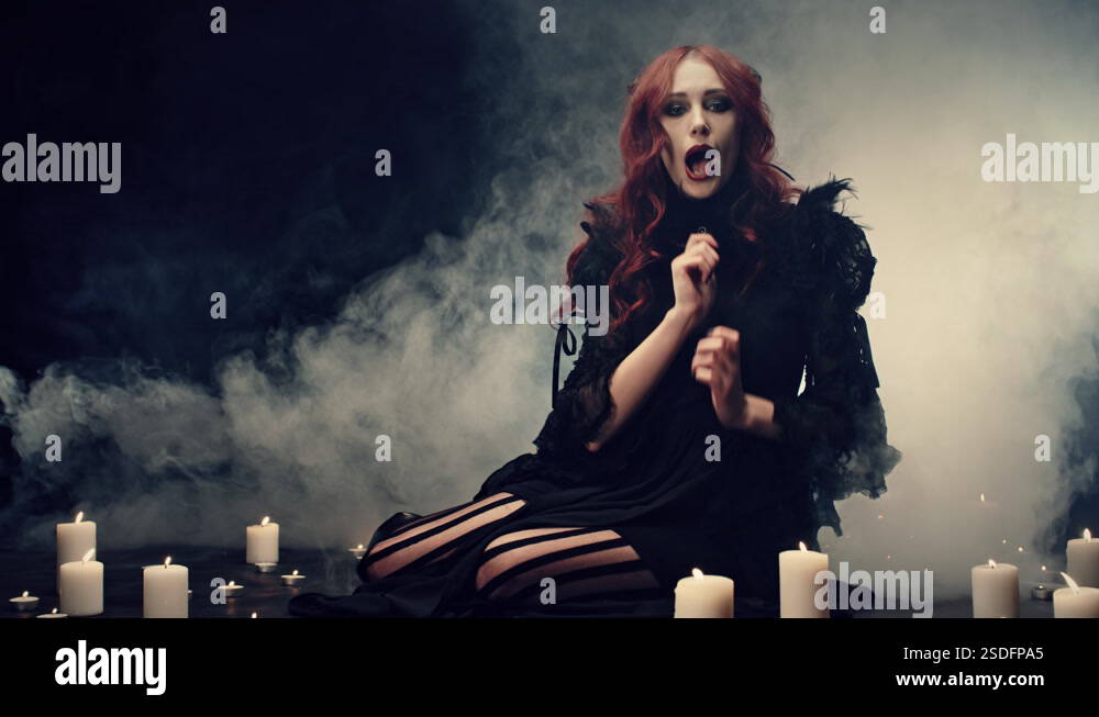 Woman dressing in dark casts, spelling, conducting ritual and summon ...