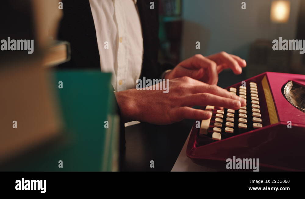 Some details closeup guy type some text on the retro typewriter in the ...