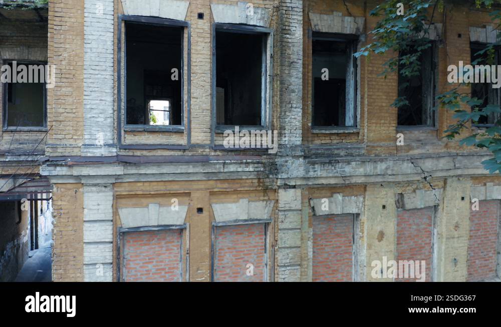 Abandoned ruined manor (mansion) house with broken windows and ...
