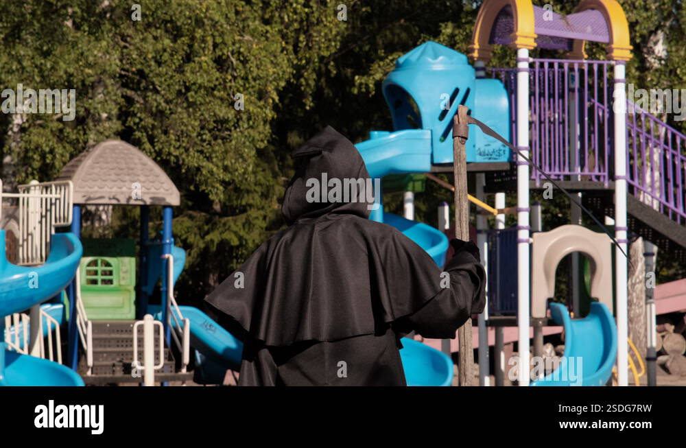 Scary Grim Reaper Walking Along the Playground Stock Video Footage - Alamy