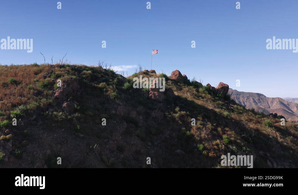 Camera is rising up above the USA patriotic flag set up in the ...