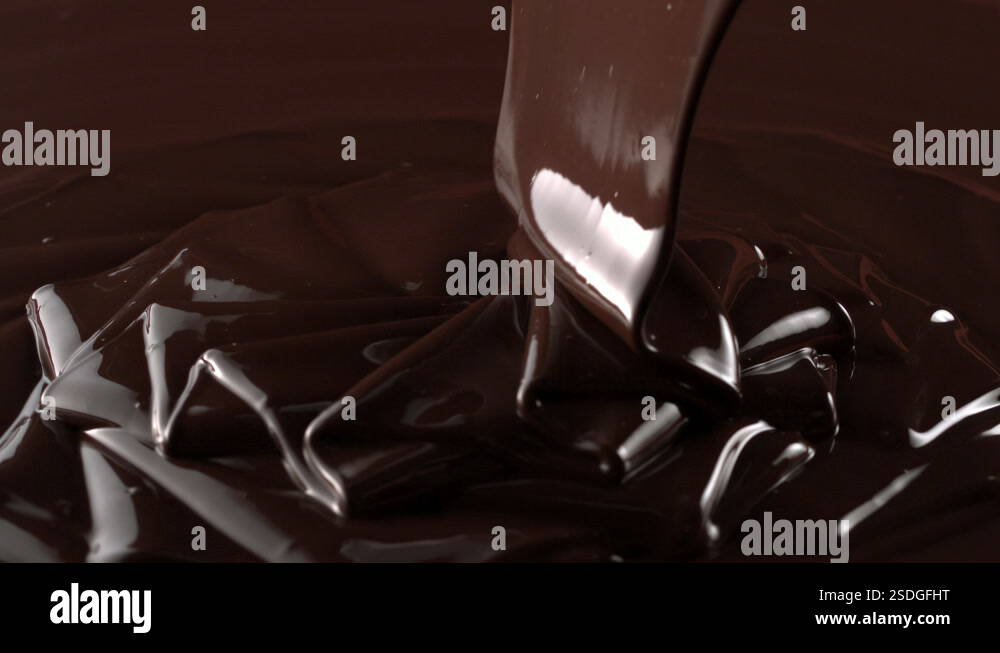 Rotation of chocolate pouring down with swirl in slow motion 4k Stock ...