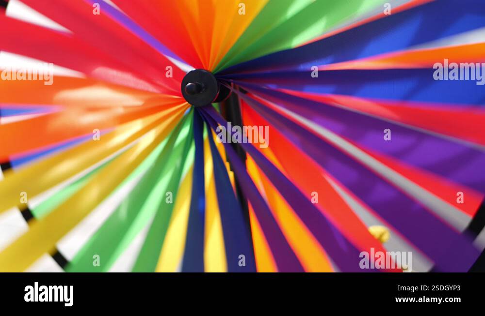 Colorful pinwheel spinning, weather wind vane, garden decoration in USA ...