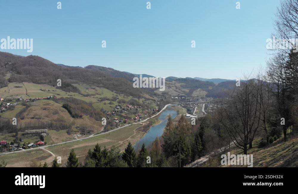 Flying in Beskid Sadecki Mountains and Poprad River near village Rytro ...