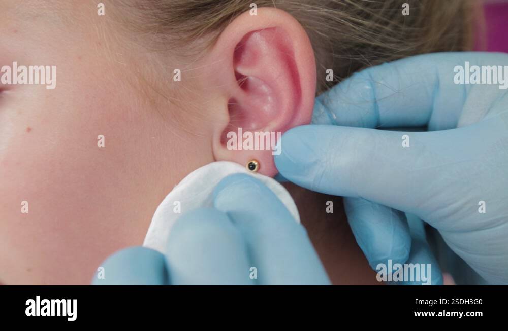Ear piercing girl Stock Videos & Footage - HD and 4K Video Clips - Alamy