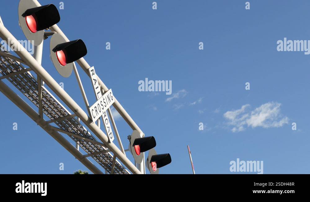 Level crossing warning signal in USA. Crossbuck notice and red traffic ...