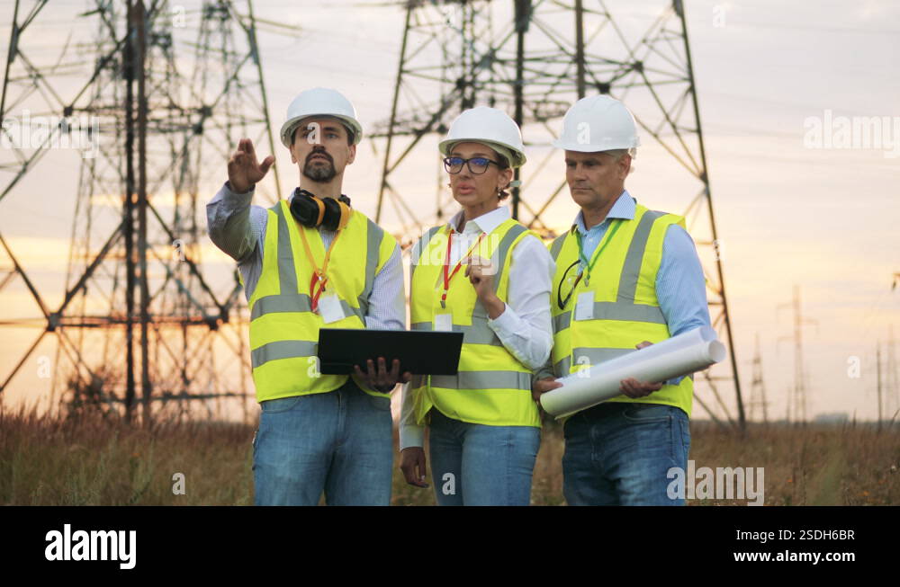 Electricity specialists are talking about a powerline project Stock ...