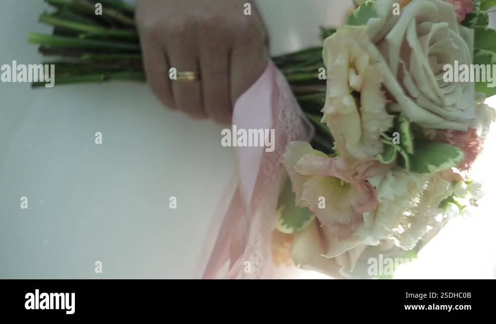 Bride holds a wedding bouquet in her hands Outdoors Stock Video Footage ...