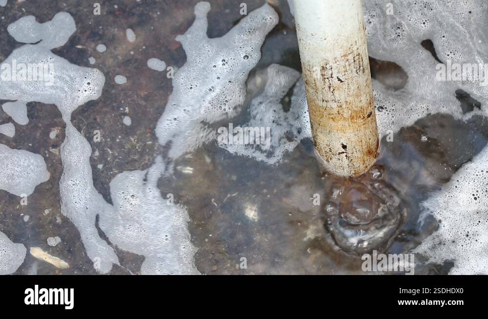 Liquid sewage fall out from effluent pipe Stock Video Footage - Alamy