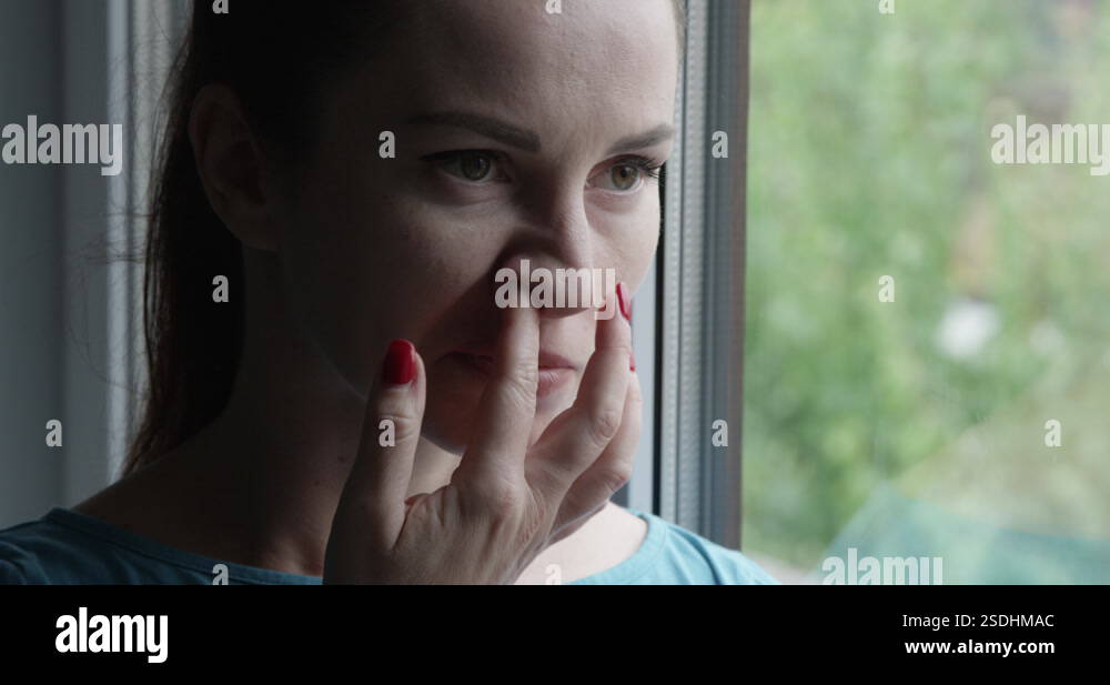 Woman Picking Nose with Red Nails Standing by the Window Stock Video ...