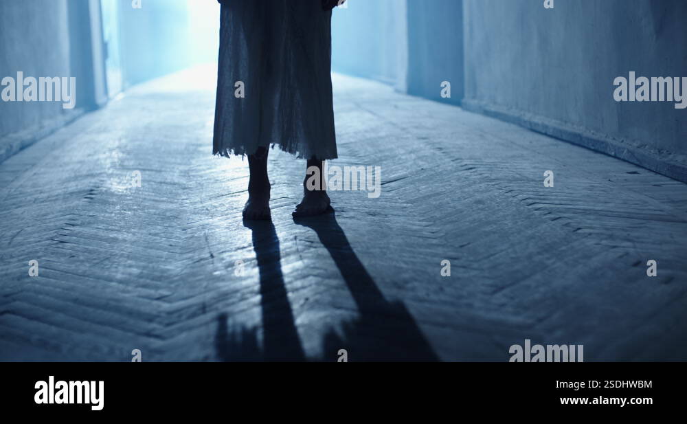 Little girl in white dress looking like a ghost slowly creeping down ...