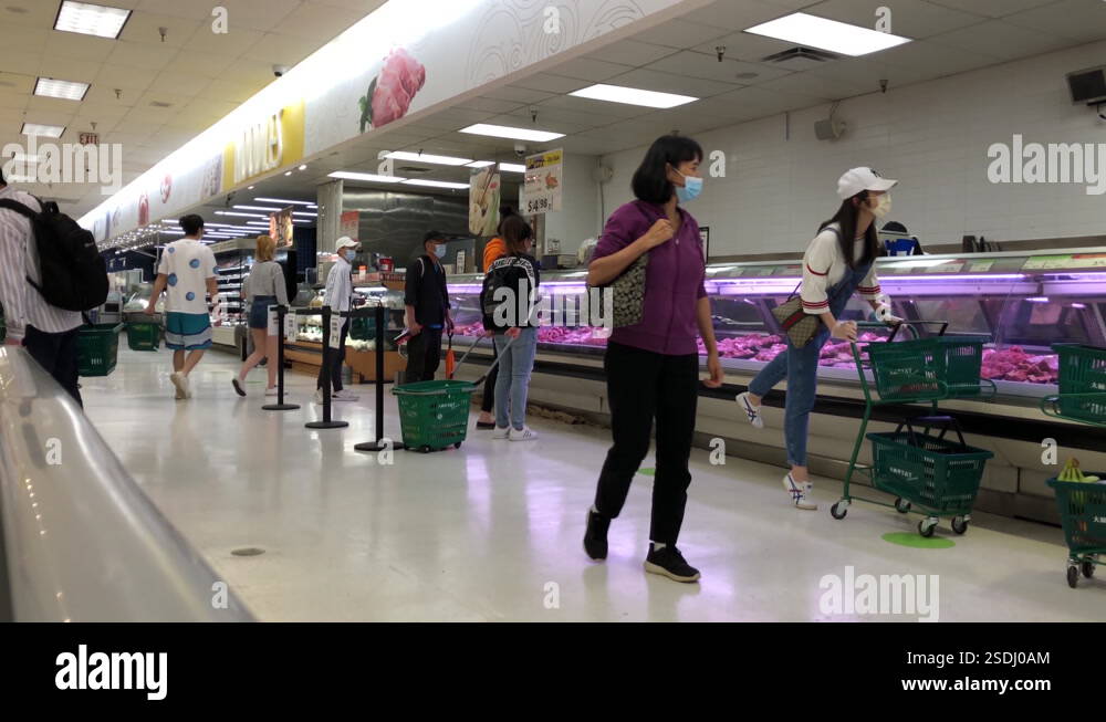 Motion of customer line up for buying meat inside T&T Chinese ...