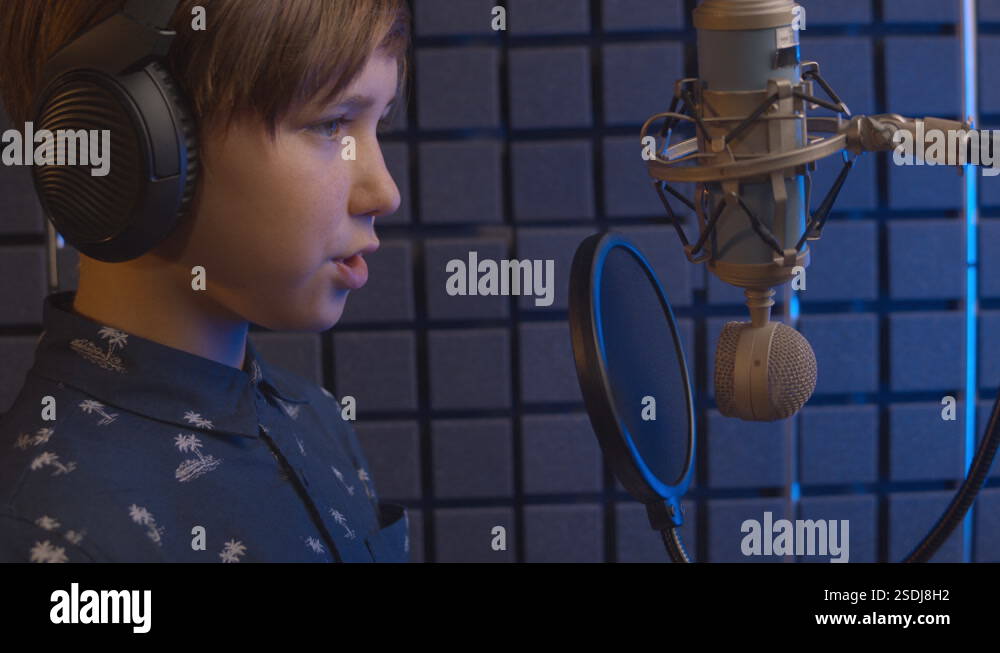 Podcast recording. Streaming platforms. Kid recording the program. An ...