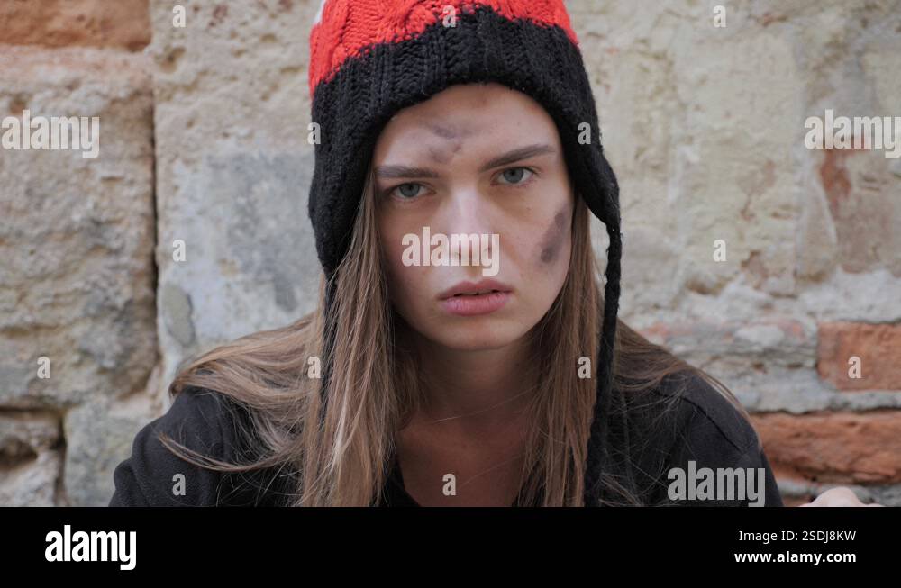 Close Up View Of A Homeless Girl In A Hat Sits On The Street And Asks For Help Stock Video