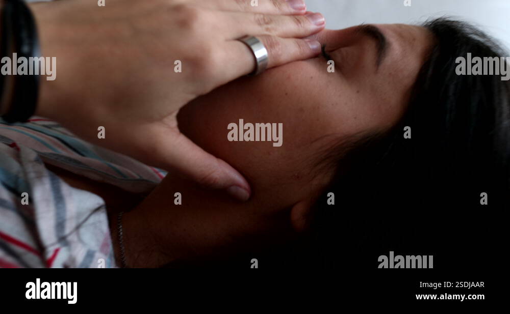 Woman rubbing face with hand waking up after nap, girl gets up from ...