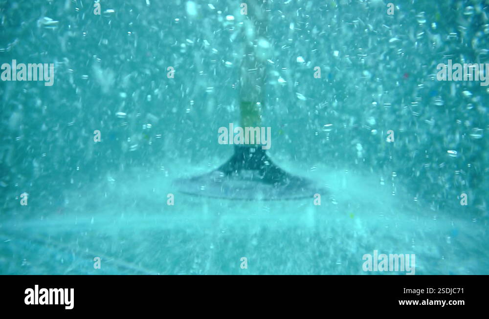 working aerator.liquid and bubbles move inside the glass container ...