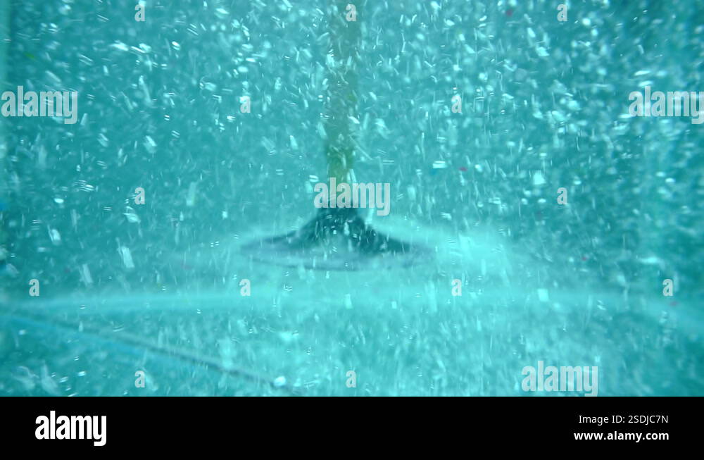 working aerator.liquid and bubbles move inside the glass container ...