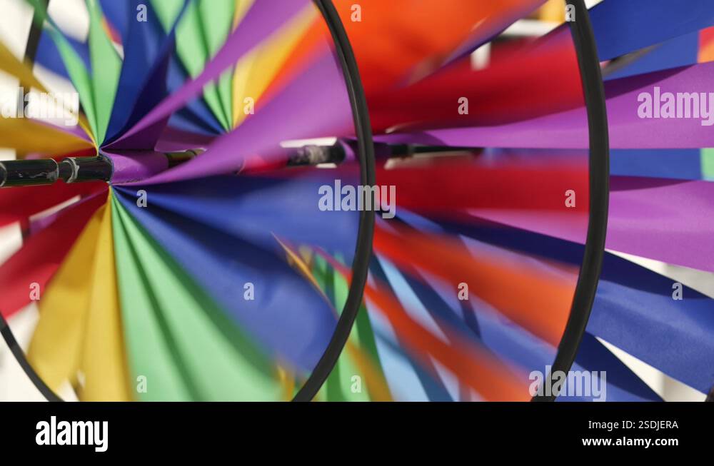 Colorful pinwheel spinning, weather wind vane, garden decoration in USA ...
