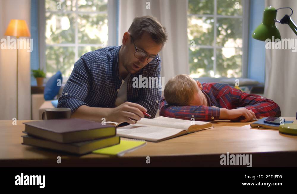Tired guys students studying preparing for exam in dormitory room Stock ...
