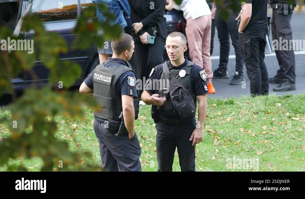 Patrol cops stopped the intruders car. Men in black bulletproof vests ...