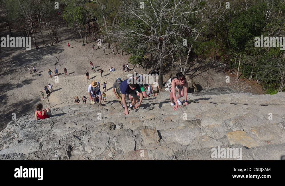 People climbing the Nohoch Mul (Ixmoja) Pyramid at Mayan Ruins in Coba ...