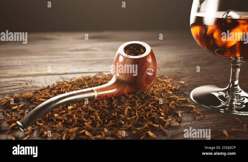 Elegant pipe and an iced drink.Old fashioned tobacco pipe with a glass ...