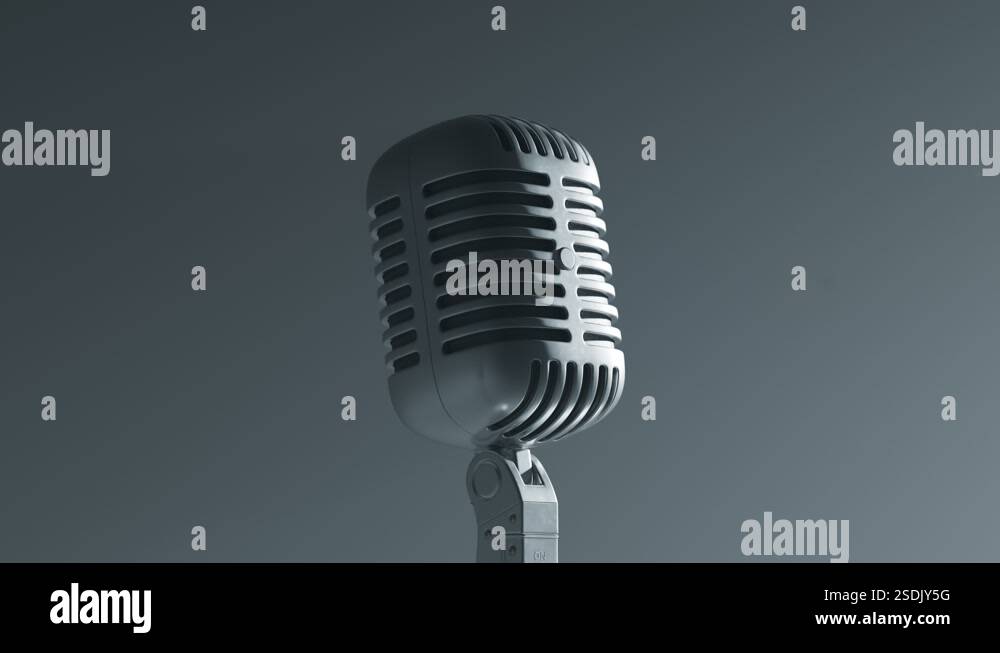 A desaturated vintage microphone on the stage. Closeup. Grey background ...