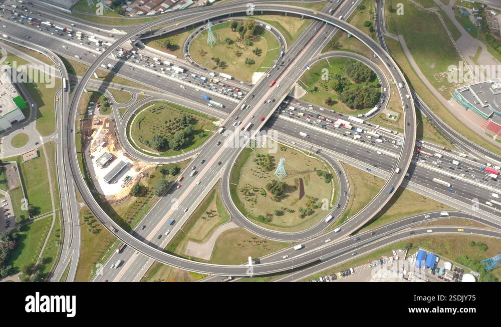 Big clover crossroads at summer in motion. Road traffic in real speed ...