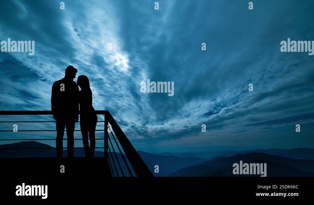 The couple standing on the balcony on the night mountain background. hyperlapse Stock Video ...