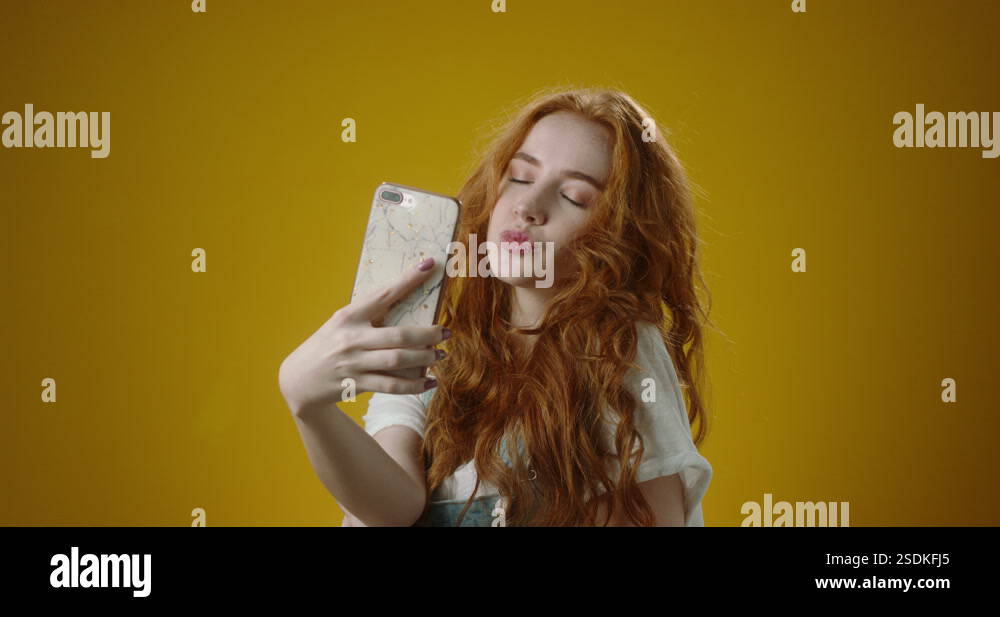 Cute Authentic Redhead Caucasian Girl Taking Selfies On Her Smartphone