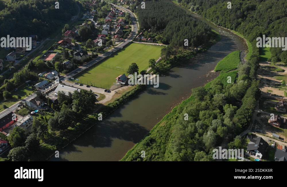 Flying over Poprad river in summer. Beskid Mountains, village Rytro ...