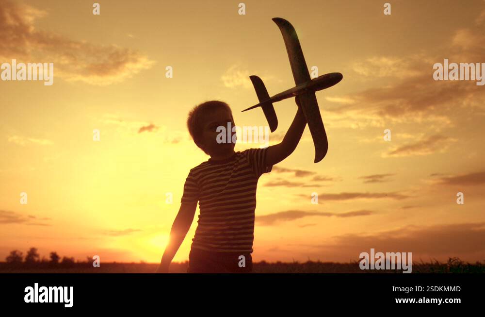 happy boy child go runs with an airplane playing pilot wants to fly. kid Stock Video Footage - Alamy