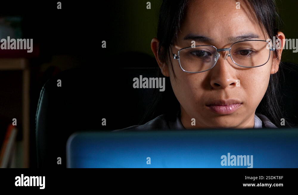 Woman was busy typing on a laptop and annoyed that her phone rang so ...