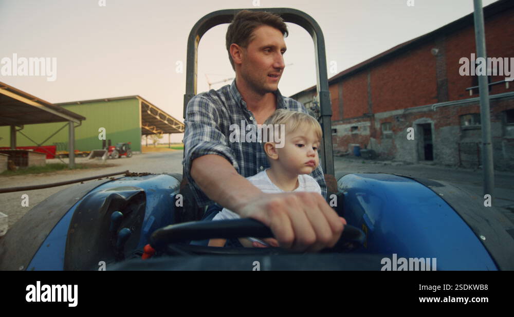 A young engineer father is explaining to his little son his work Stock ...