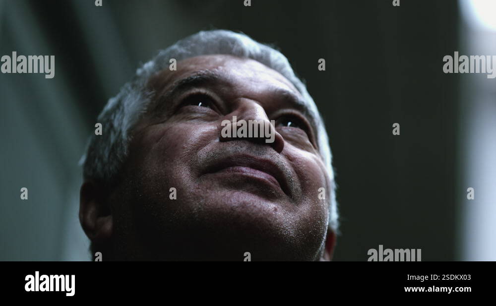 Hopeful middle aged man close-up face. Unshaven stressed senior feeling ...