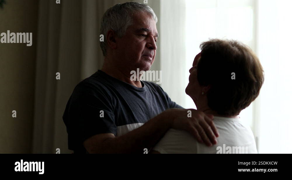 Older couple embrace, senior emocional intimacy. middle aged husband ...