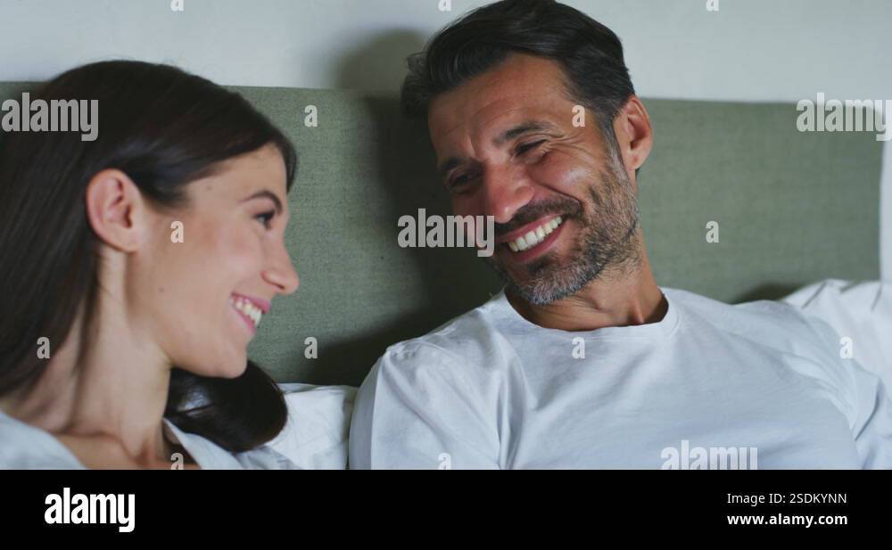 Couple in love having fun to speak and laughing while resting together ...
