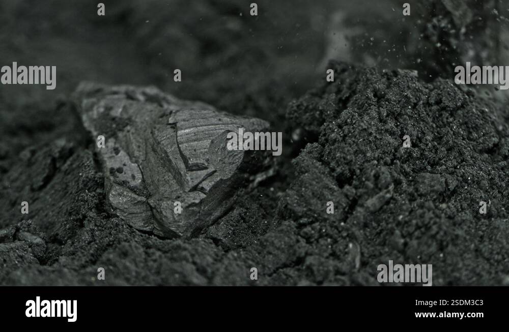 Super Slow Motion Shot of Coal Falling into Black Powder at 1000 fps ...